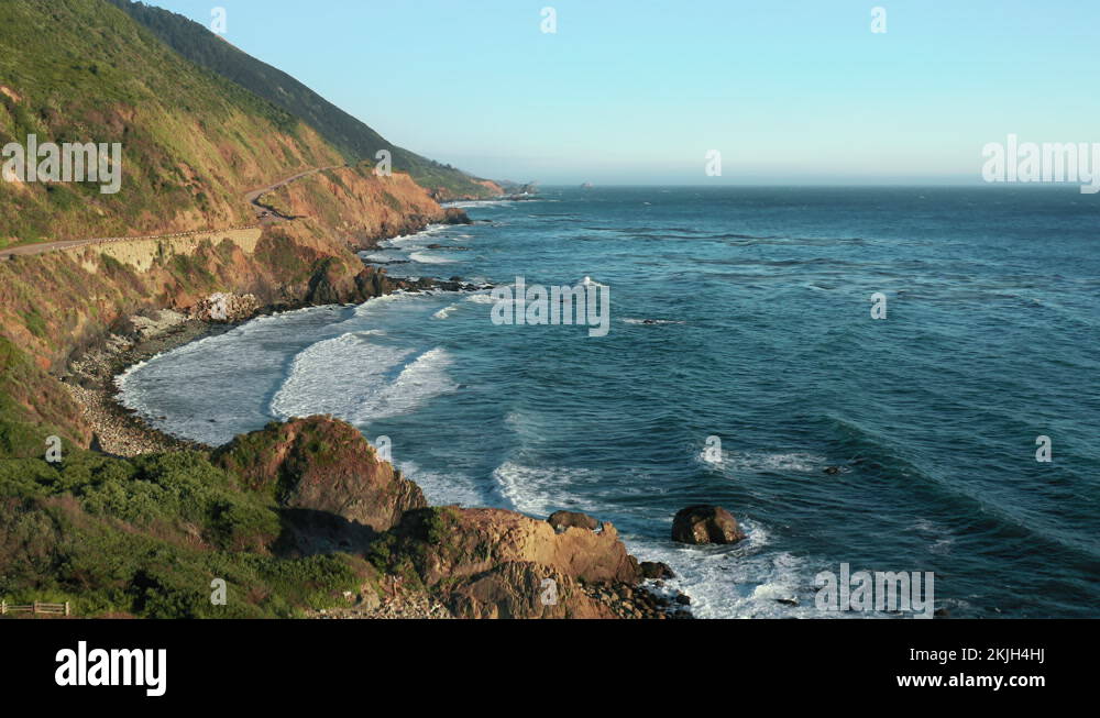 4K cinematic aerial of golden light covering the scenic beautiful blue ...