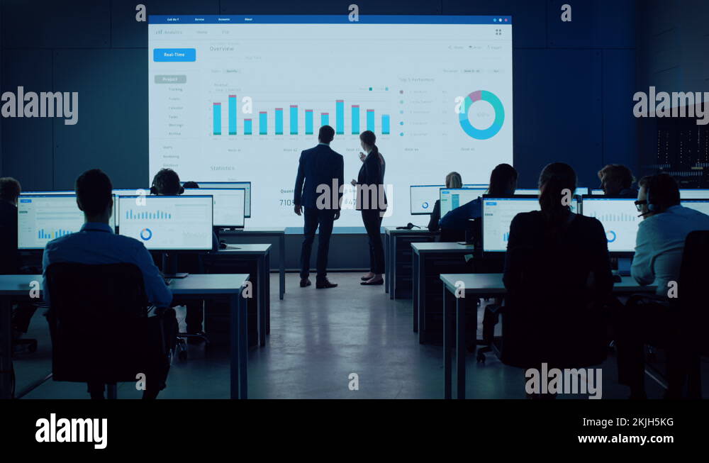 Two Computer Data Science Engineers Talk Next to Big Screen Stock Video ...