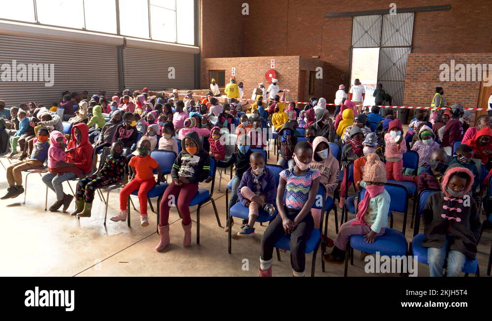 Poor and hungry children sit and wait for food to be distributed,Covid ...