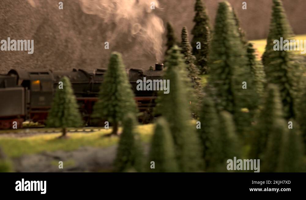 Model of railway freight train passing the forest Stock Video Footage ...