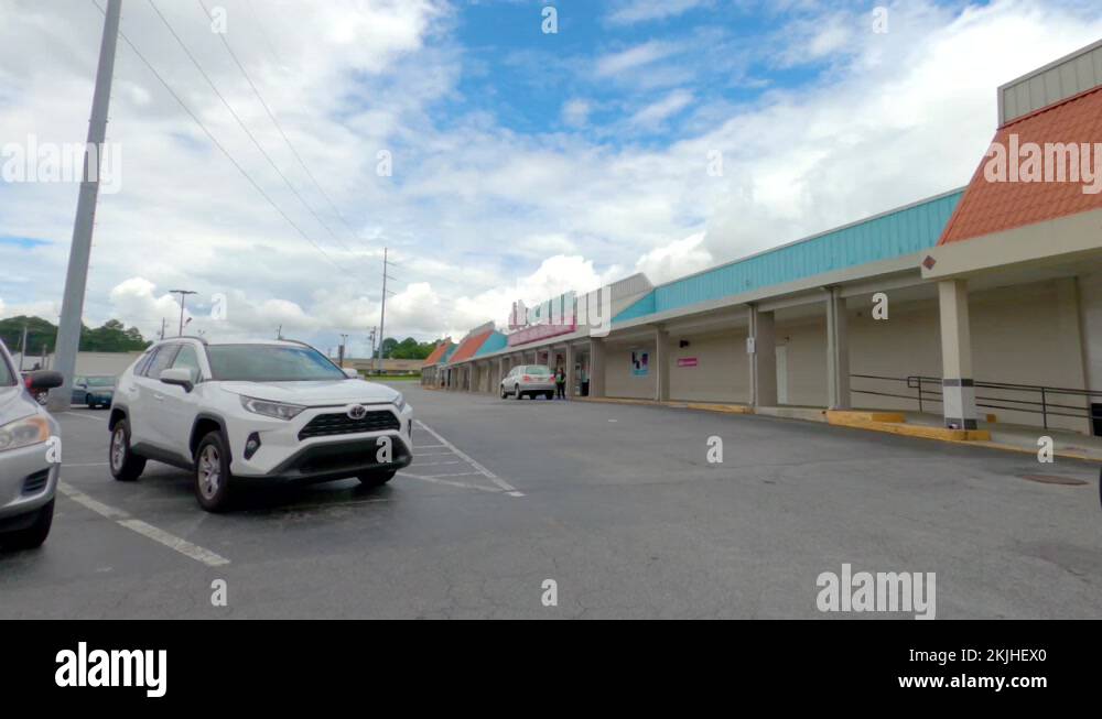Urban retail strip mall shopping center parking lot exterior Stock ...
