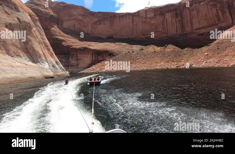 Family fun ski and tube behind fast boat Lake Powell Utah 4K Stock ...