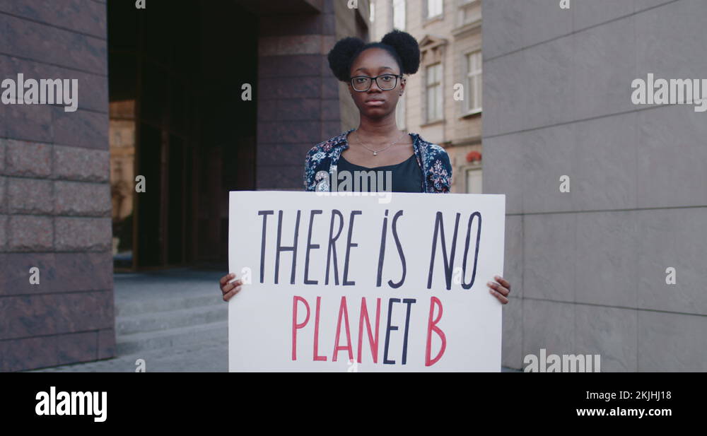 Portrait of african american activist holding placard with there is no ...