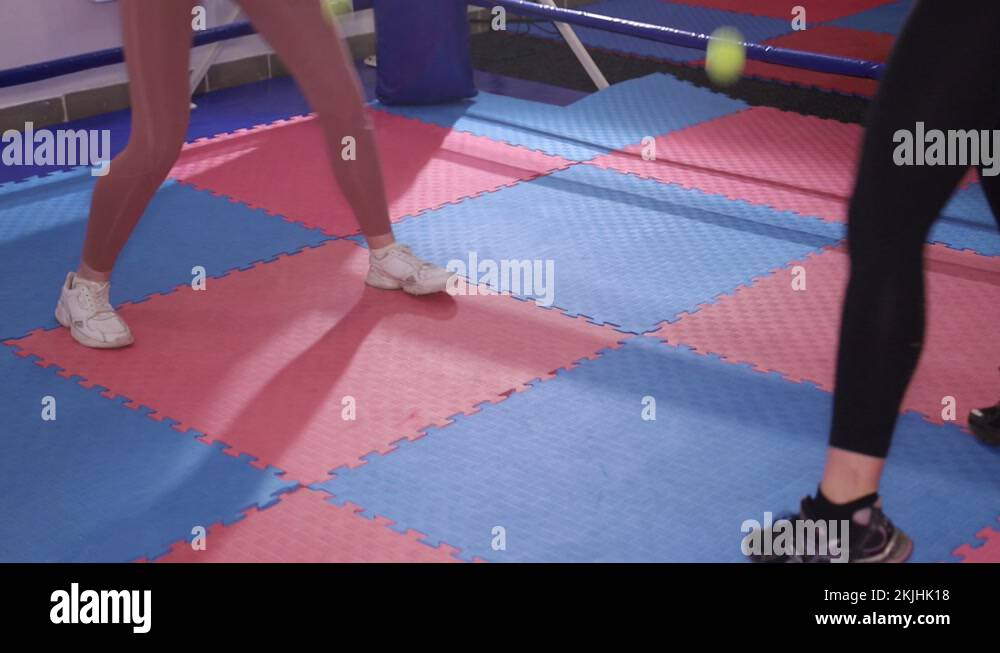 Two female boxers train with balls in the ring. Girls in training Stock ...