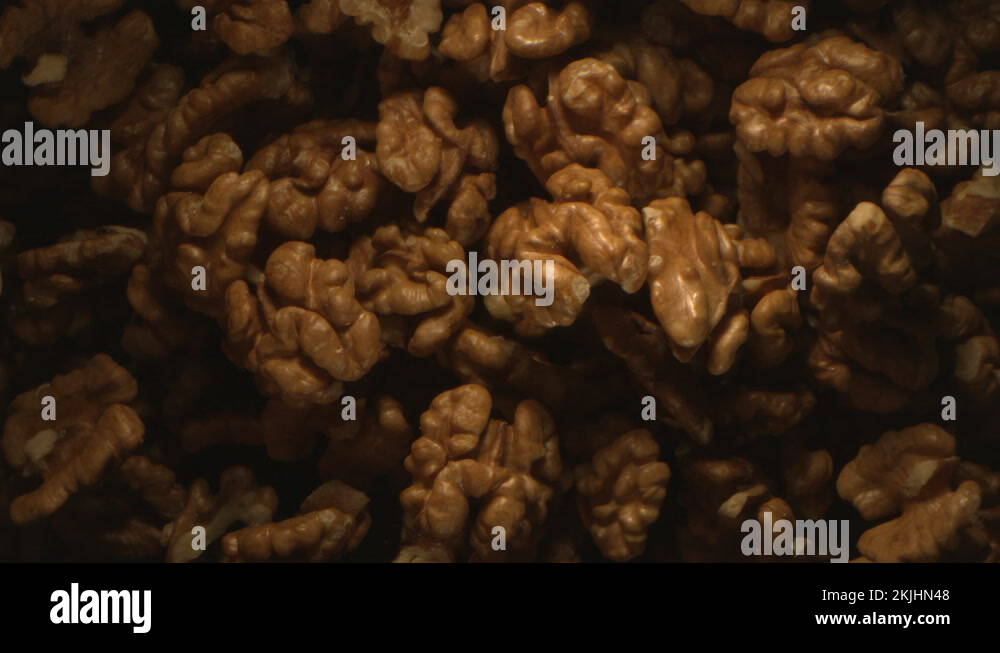 Walnut Nuts Thrown in the Air in High Speed Flying on Black Background ...