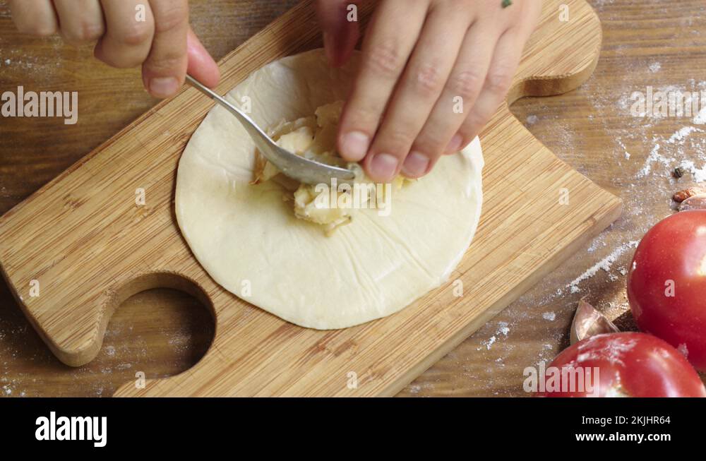 Man cooking empanada argentinian pie, traditional bakery from argentina ...
