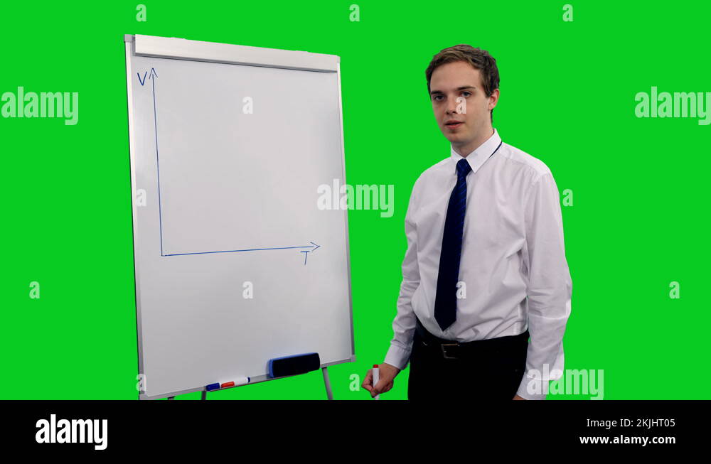 Young intelligent student drawing a graph of two variables on board ...