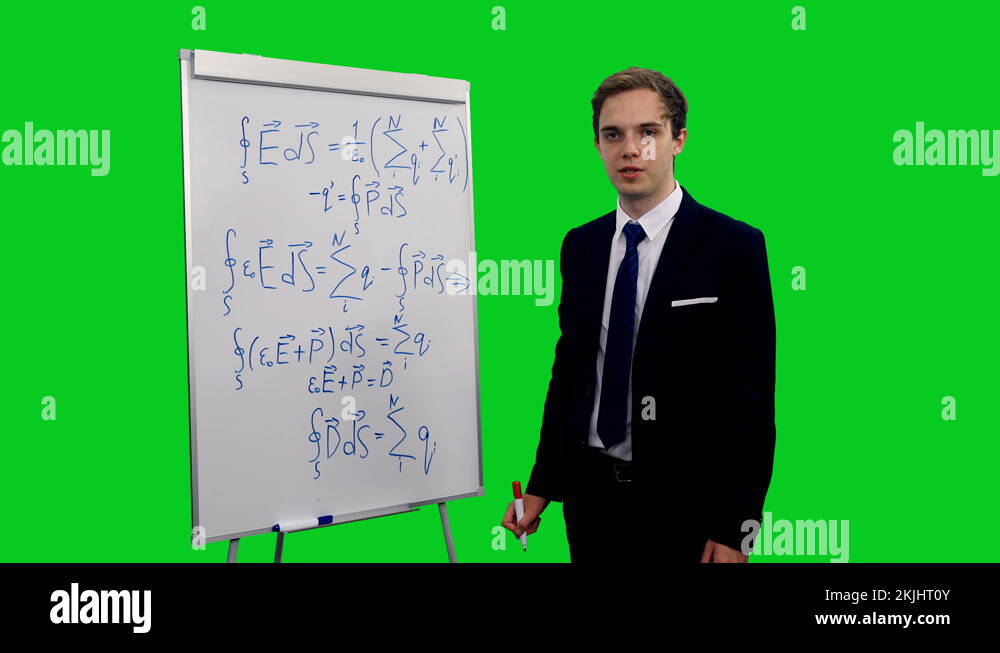 Young intelligent man in suit explaining formulas on whiteboard, chroma ...
