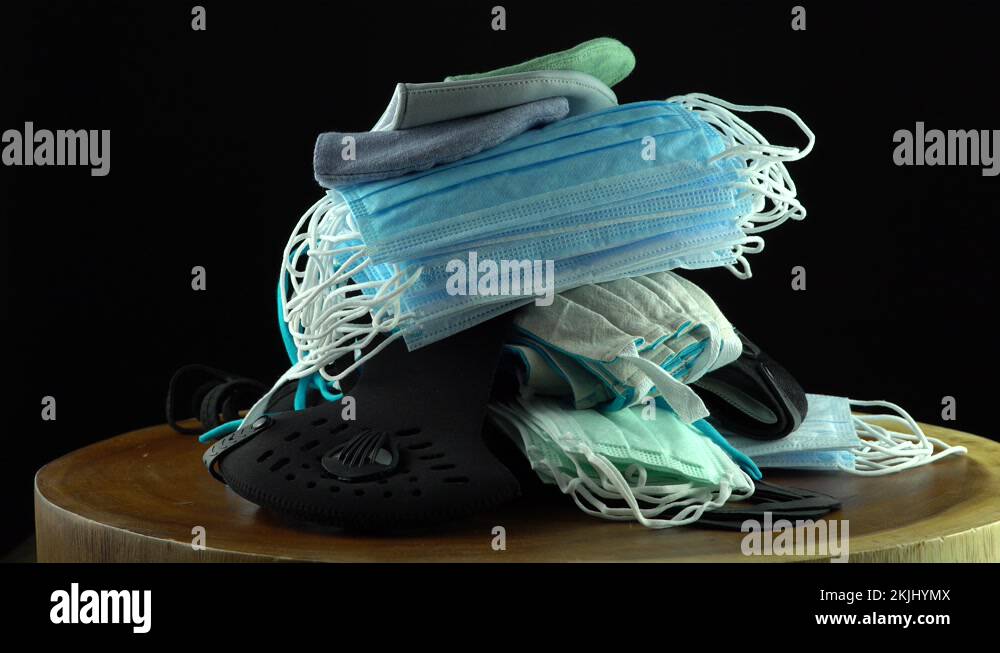 Disposable and reusable medical and dust masks pile for protection ...