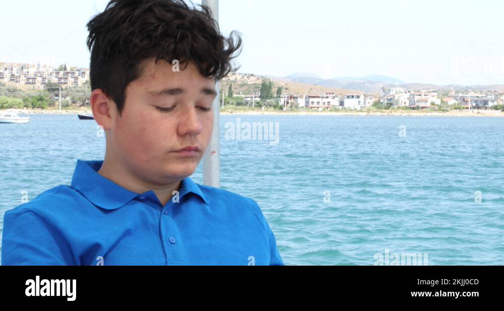 Teenage boy vomiting during the boat travel 3 Stock Video Footage - Alamy