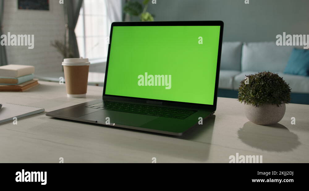 The table of distant worker at home. Modern laptop computer with chroma ...