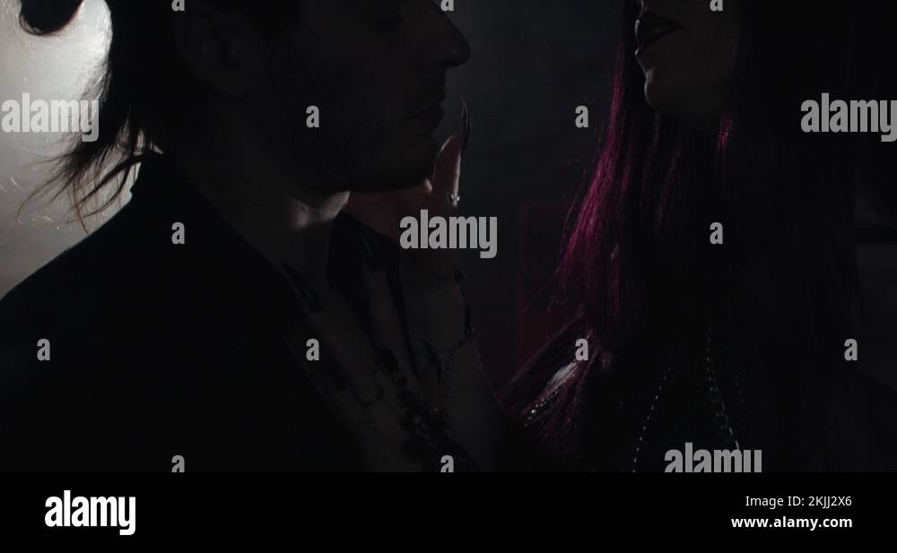 Female demon, succubus is seducing a man, touching him, dark room, 4k ...