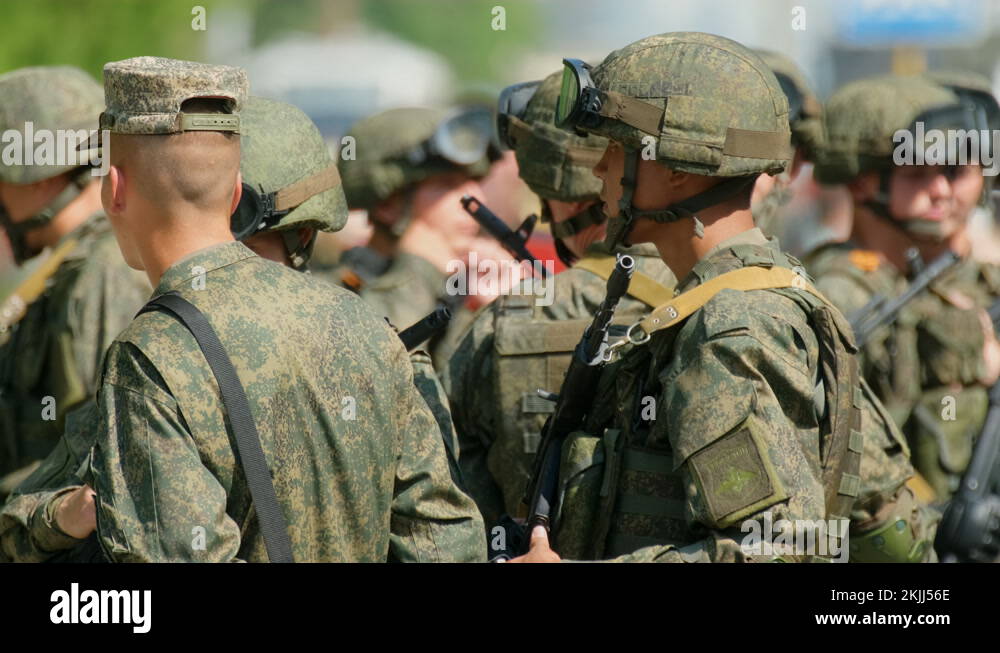 Soldiers police patrolling street city stand close up control order ...