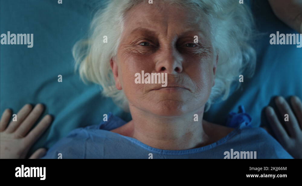 Close Up Of Paramedics Putting On Ill Old Lady Face Oxygen Inhalation