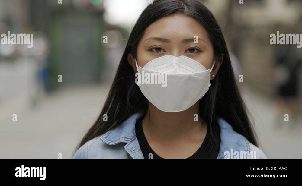 Young Asian woman wearing a mask face portrait take off and smile Stock ...