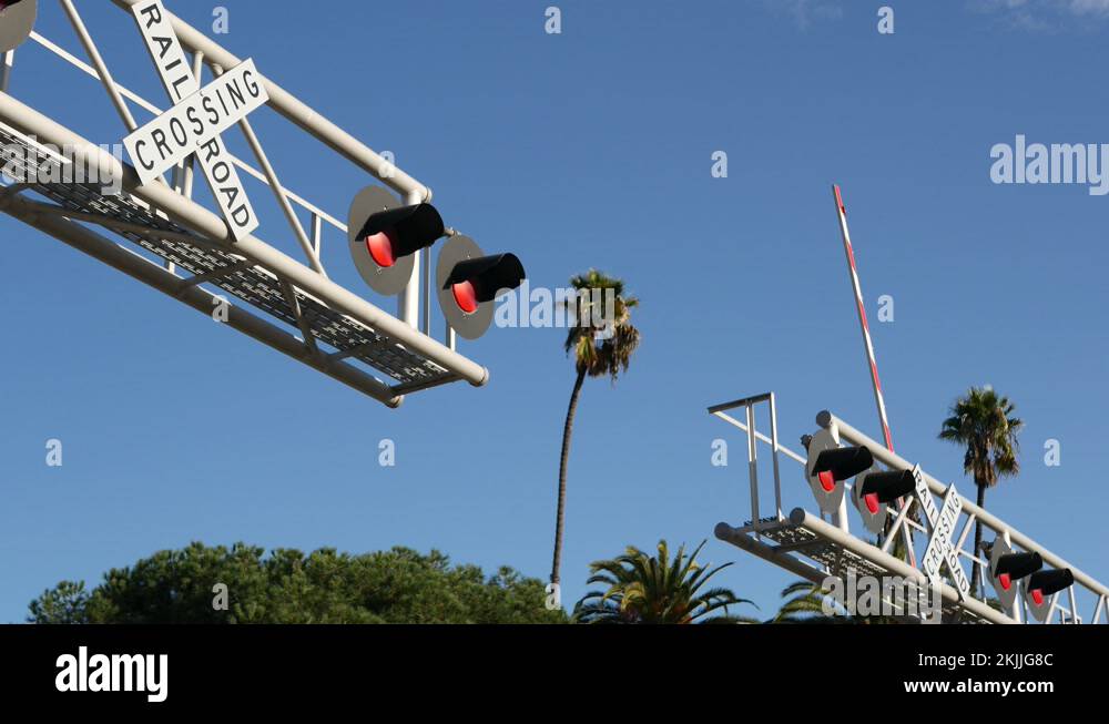Level crossing warning signal in USA. Crossbuck notice and red traffic ...