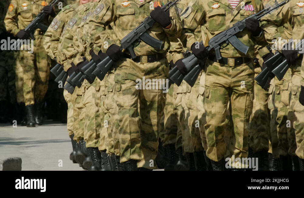 March military officers with assault rifle kalashnikov ak 47 in arm ...
