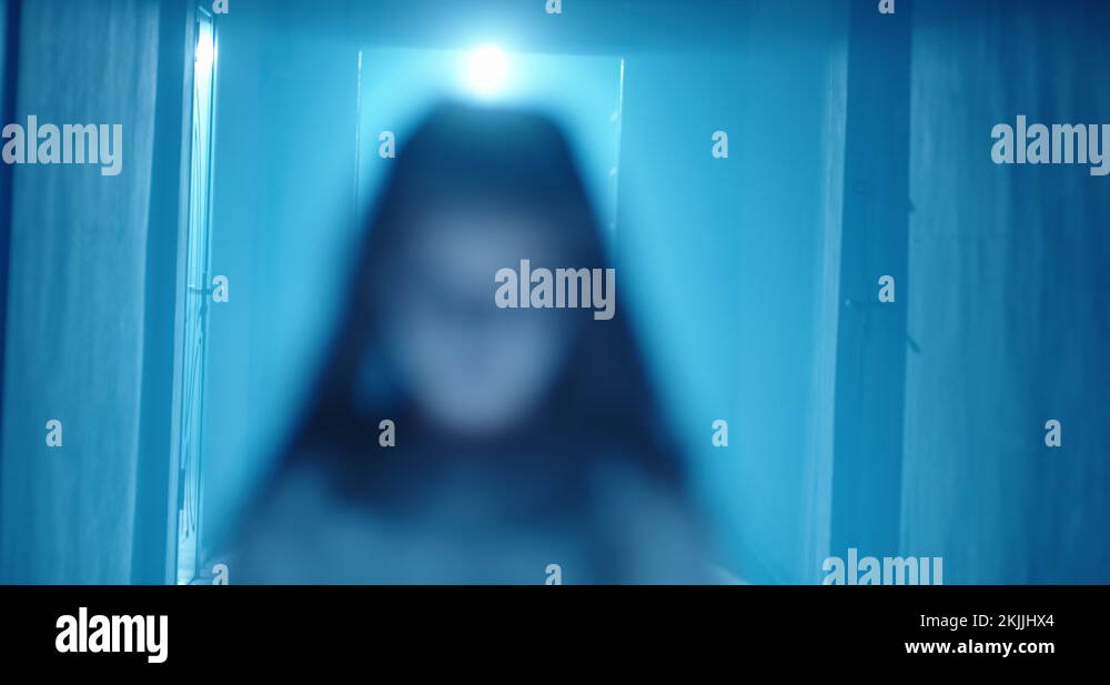 Demonic psycho child in cursed house. Little girl, dressed in halloween ...