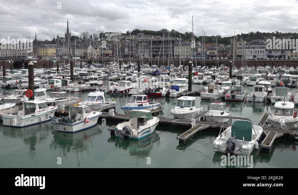 Fishing boats and sailing vessels in port of Fecamp, popular coastal ...
