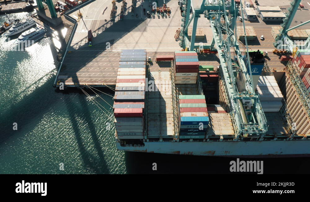 4K aerial of industrial port, Los Angeles, USA. loading container ship ...