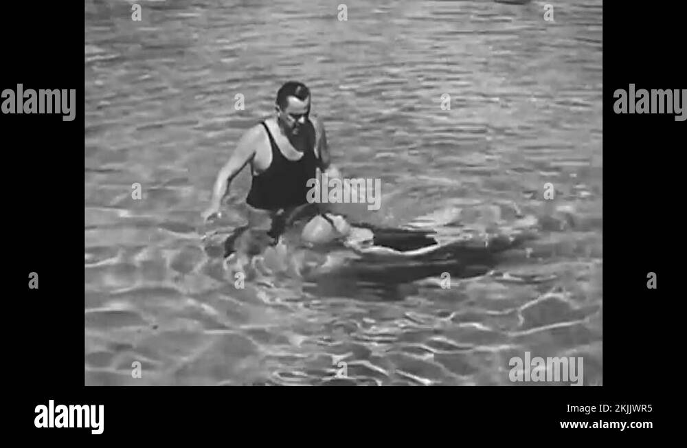 A Beginning Swimmer Swims On Her Back In Seawater During A Swimming