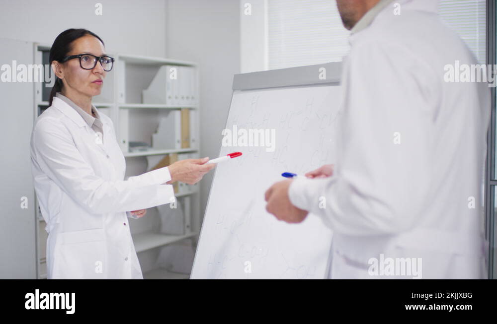 Scientists in laboratory discussing Stock Videos & Footage - HD and 4K ...