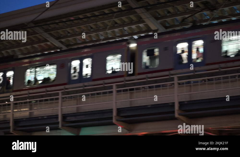 Commute train running overpass metal structure rail bridge in Tokyo ...