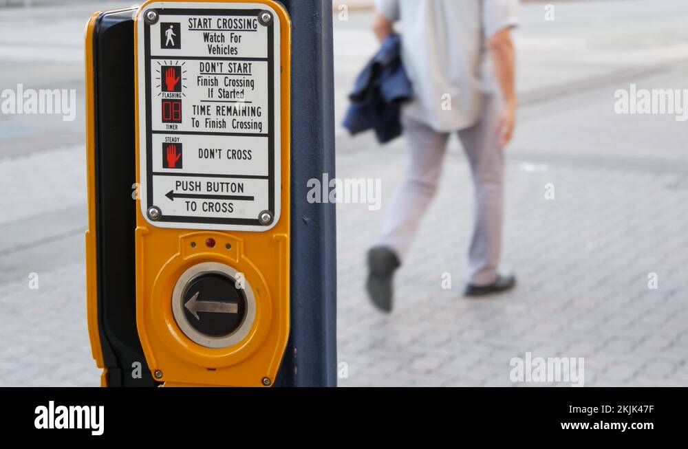 Traffic light button on pedestrian crosswalk, people have to push and ...
