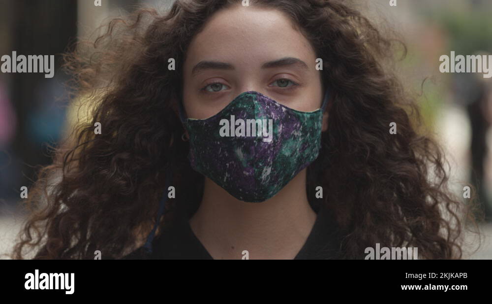 Young woman taking off a mask smiling happy coronavirus covid Stock ...