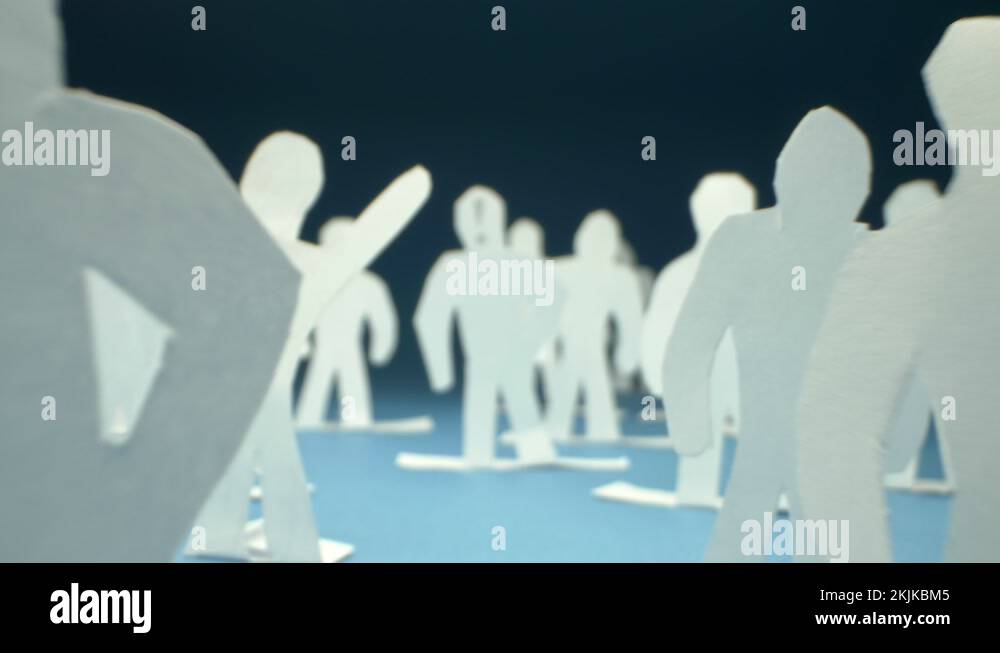 super closeup. silhouettes of people cut from paper. community concept ...