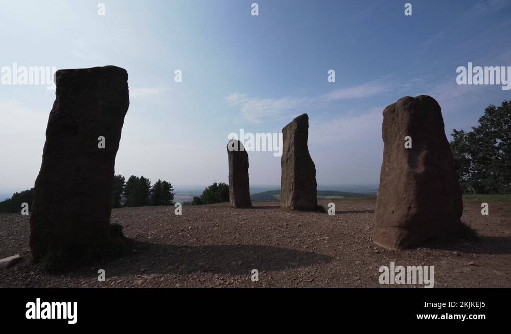 A man walking through an ancient stone formation in the UK Stock Video ...