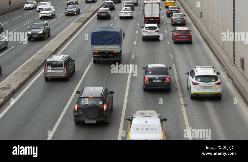 Cars drive in dense stream along Garden Ring in capital city. Tunnel at ...