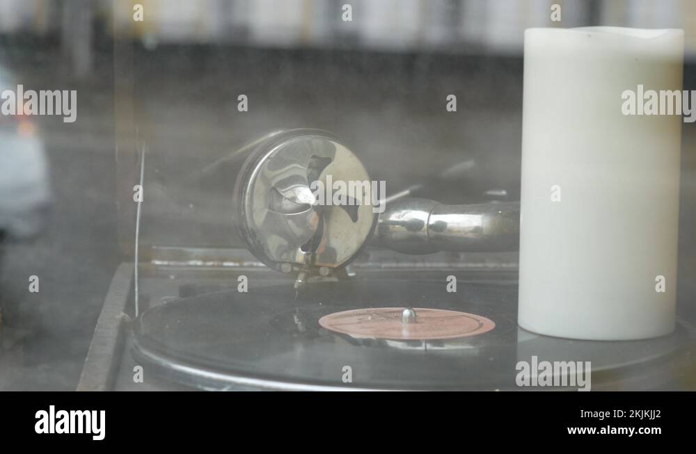 Vintage gramophone with old-fashioned vinyl record disc in a shop ...