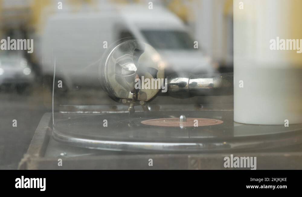 Vintage old-fashioned gramophone with vinyl record disc in a shop ...