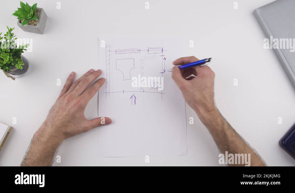 Man draw, sketch an object to be crafted, architectural drawing Stock ...