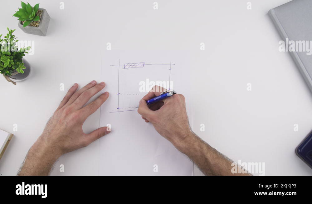 Man draw, sketch an object to be crafted, architectural drawing Stock ...