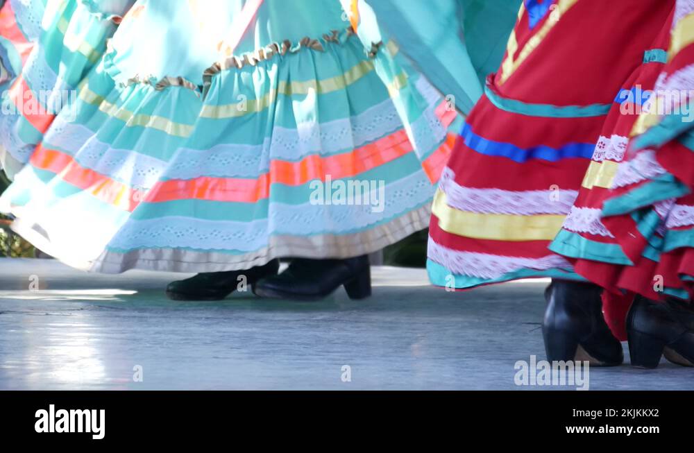 Latino women in colourful traditional dresses dancing Jarabe tapatio, mexican Stock Video ...