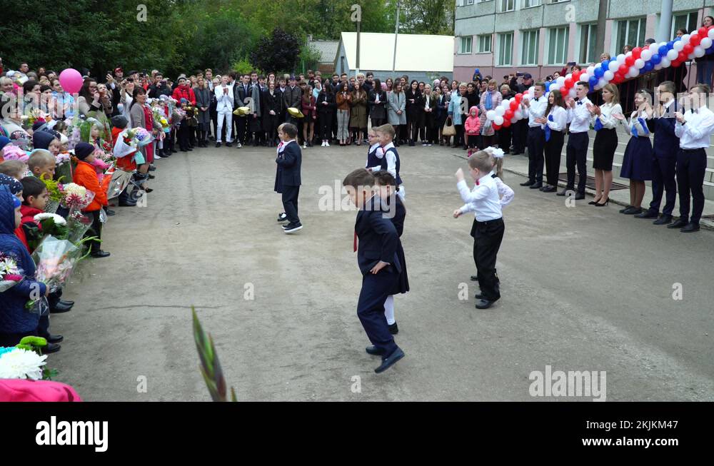 Celebrating the day of knowledge. Primary school students dance in ...