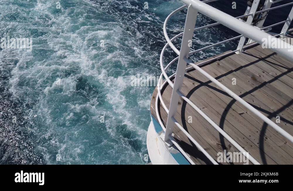 White foam trail behind motor boat or ship. Water splatter behind ship ...