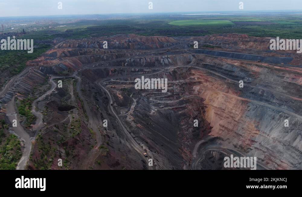 Mining industry, footage of a huge quarry with roads in it, aerial view ...