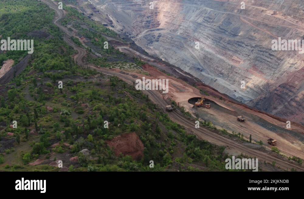 Mining quarry with roads and heavy machinery in it, view from high ...