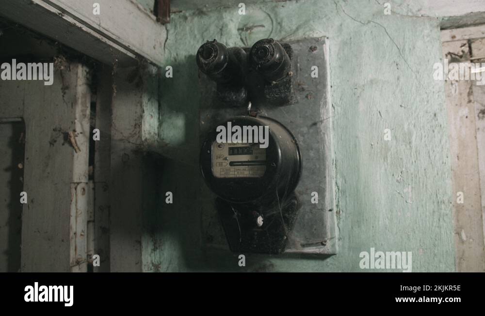 Electricity power meter from Soviet times in an abandoned old house ...