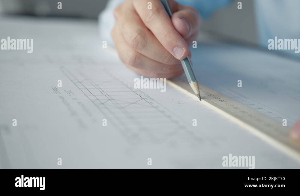 Architect's hands drawing a building plan Stock Video Footage - Alamy
