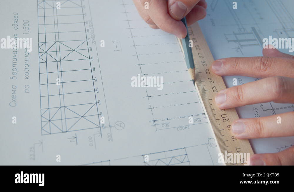 Engineer's hands drawing a building plan Stock Video Footage - Alamy