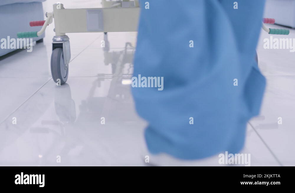 Medical worker feet walking after stretcher, transporting patient to ...