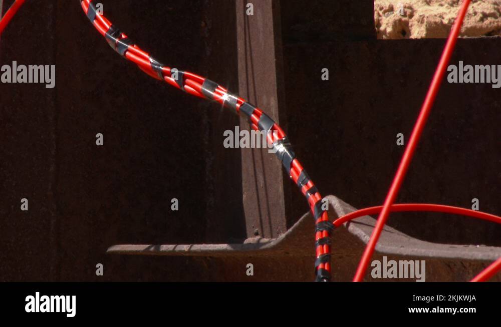 Mining of a metal structure with a red dynamite block TNT. Blasting ...
