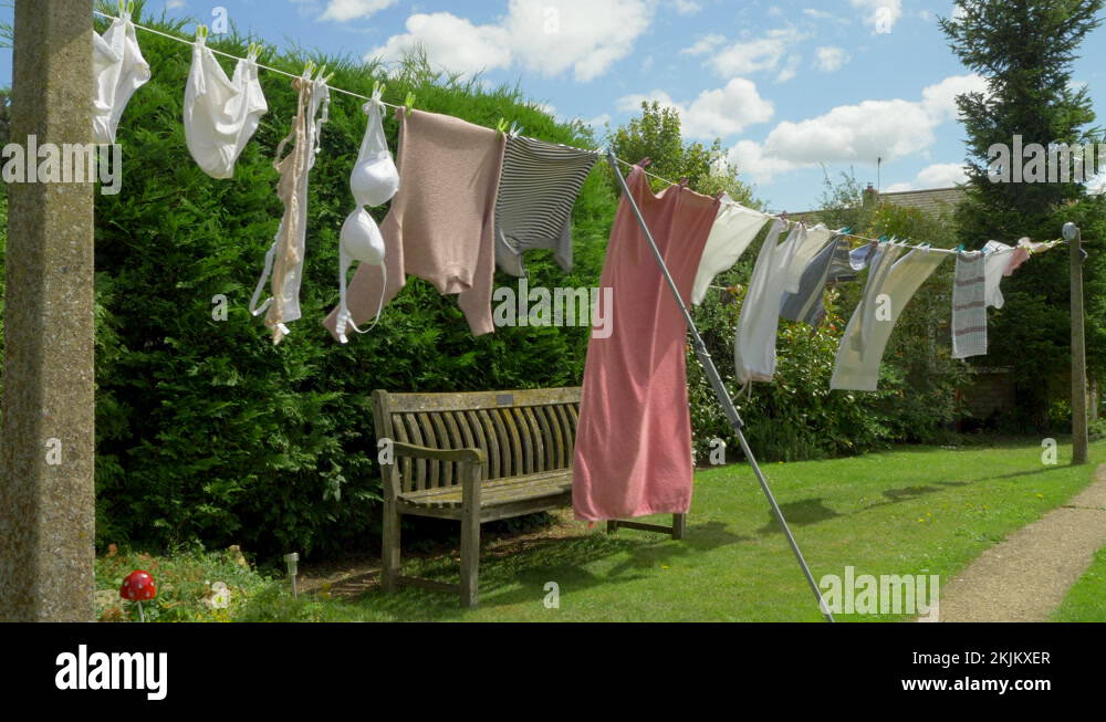Laundry blowing dry on a washing line / clothesline in a strong breeze ...