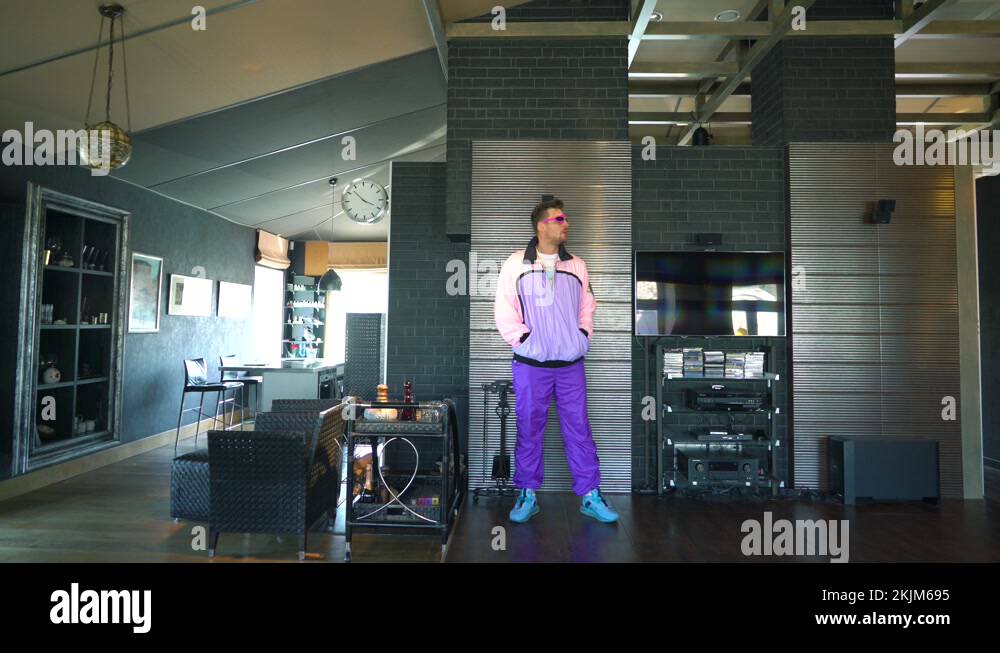 An unusual sports freak in a stylish bright suit of the 80s Stock Video ...