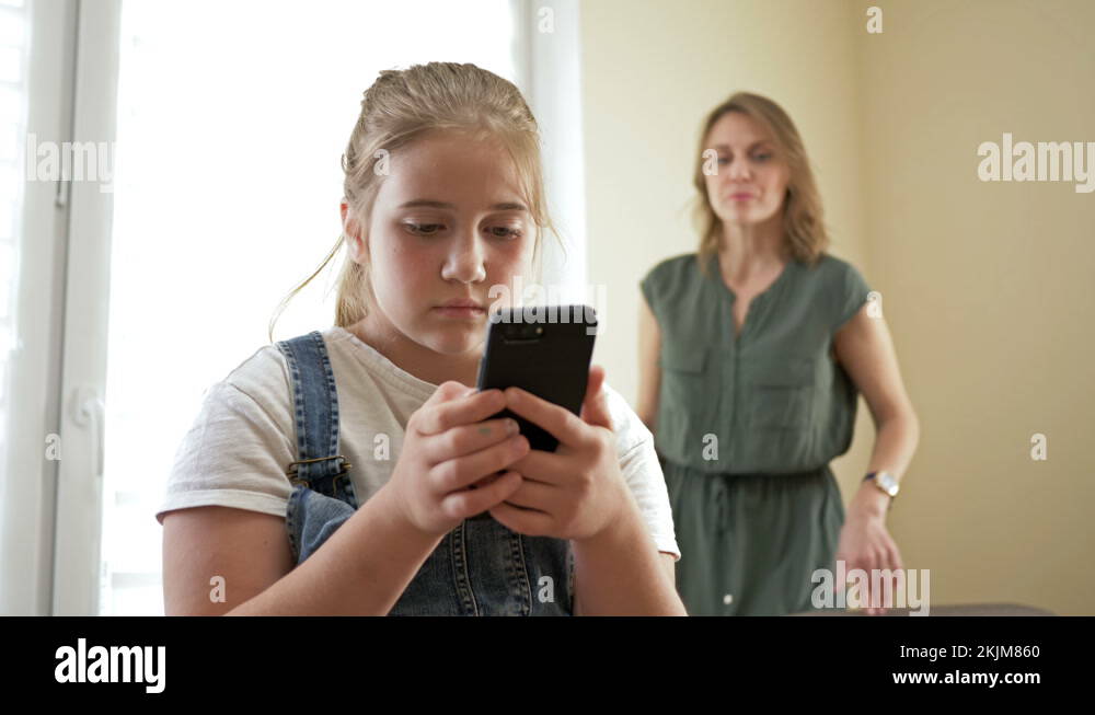 Mom is outraged that her teenage daughter is watching on her cell phone ...