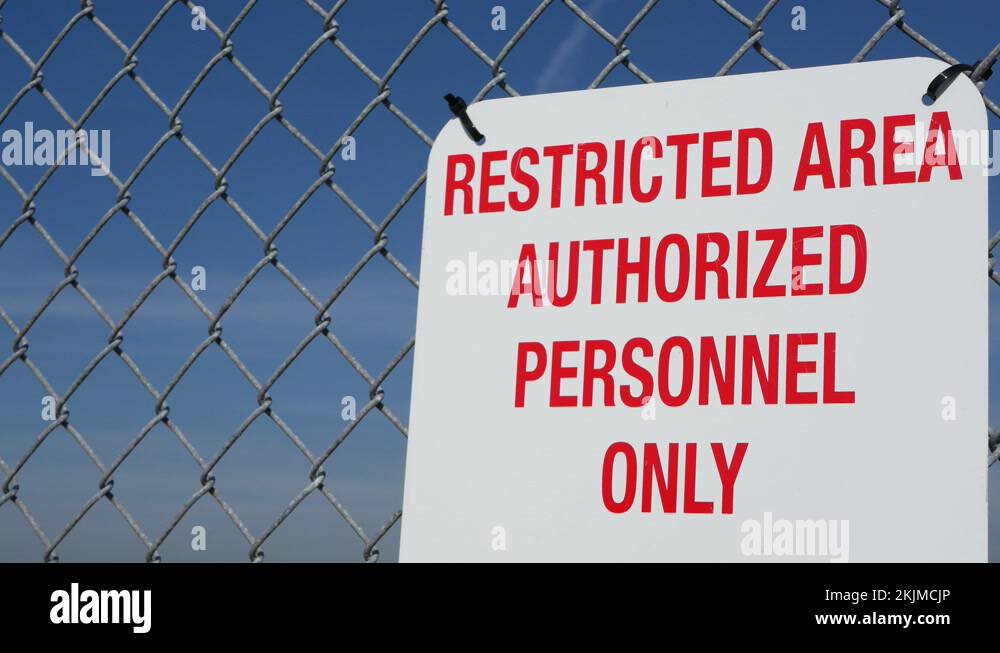 Restricted area, authorized personnel only sign in USA. Red letters ...